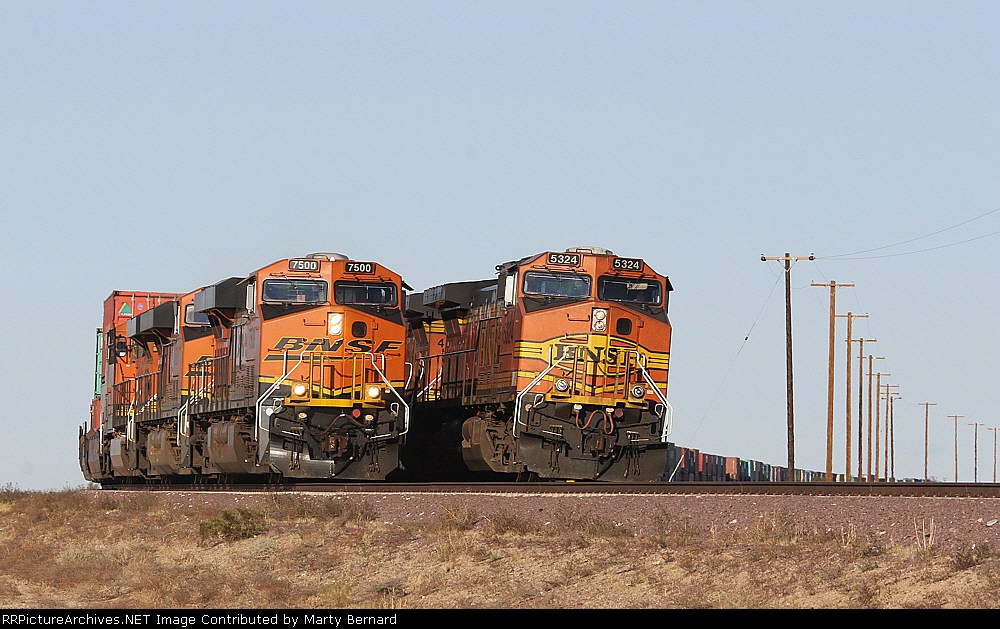 BNSF 7500 on Siding Passes 5324 Holding the Main -- Two Stack Trains